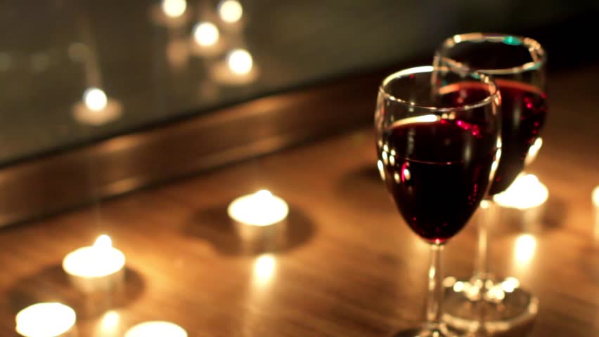 Two Glasses Of Wine And Candle In The Middle Stock Footage Video 2750231 Shutterstock