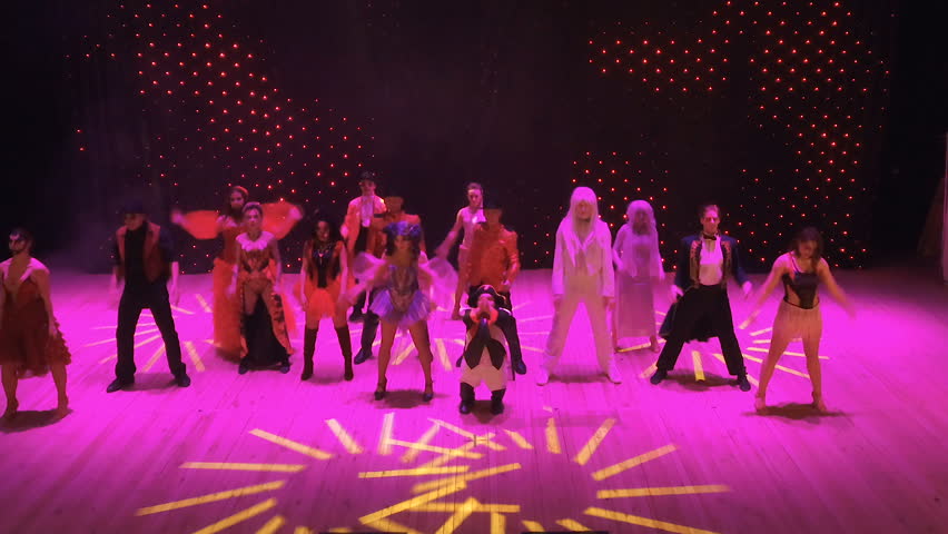 Crazy People Dances In Colorful Lights At Stage In Modern Theatre Stock ...