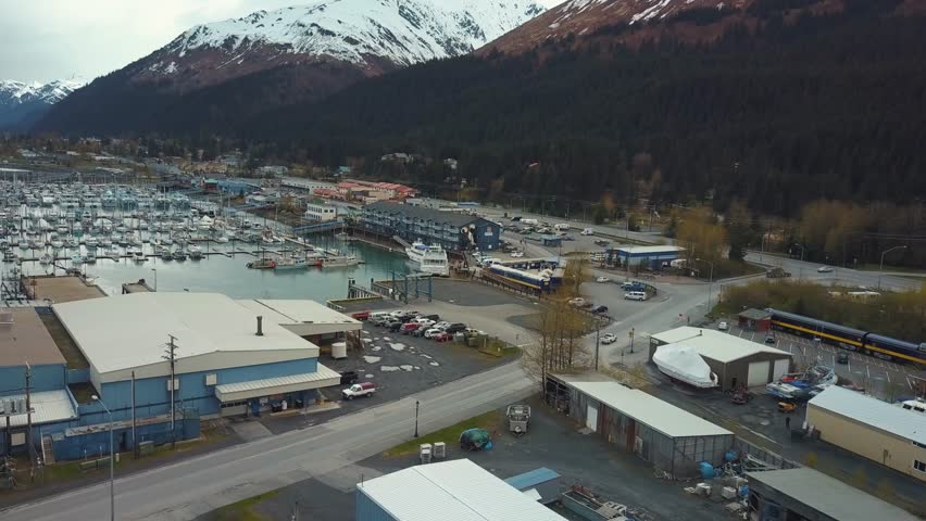 Boats in the harbor and Mountains in the Landscape in Seward, Alaska ...