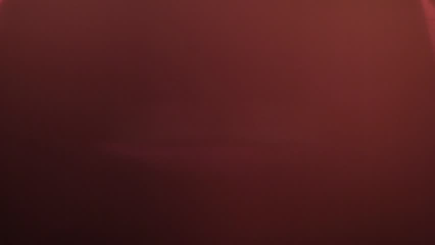Subtle Light Leak On Black Background, Moving Lens Flare. Red - Orange ...