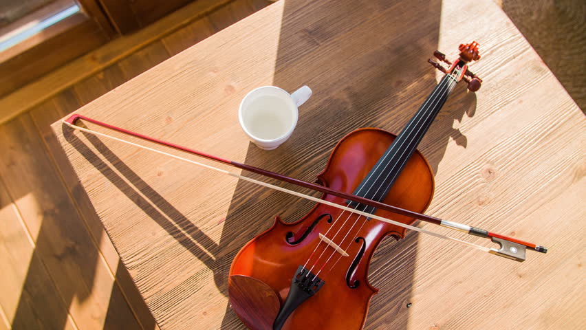 Violin Laying On Table With Hot Coffee Mug And View Outside 4K. Music ...