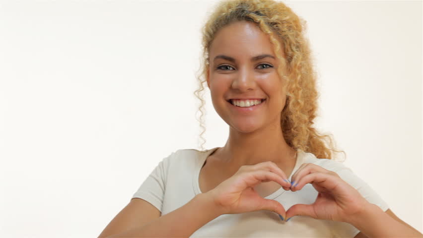 Stock video of red-haired mulatto girl showing heart shape | 11149121 ...