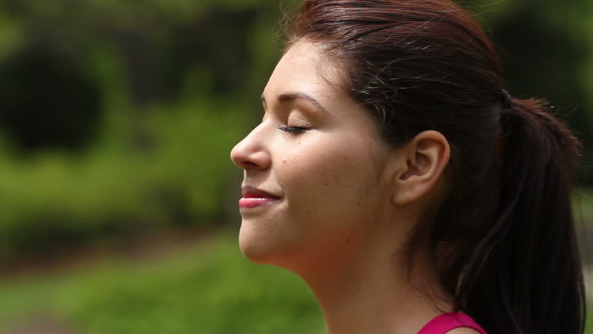 Stock Video Clip of Pretty young woman basking in the sun, | Shutterstock
