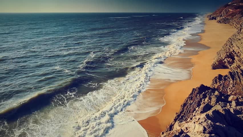 Cinemagraph Loop - Ocean Waves Breaking On A Desert Beach. Motion Photo ...