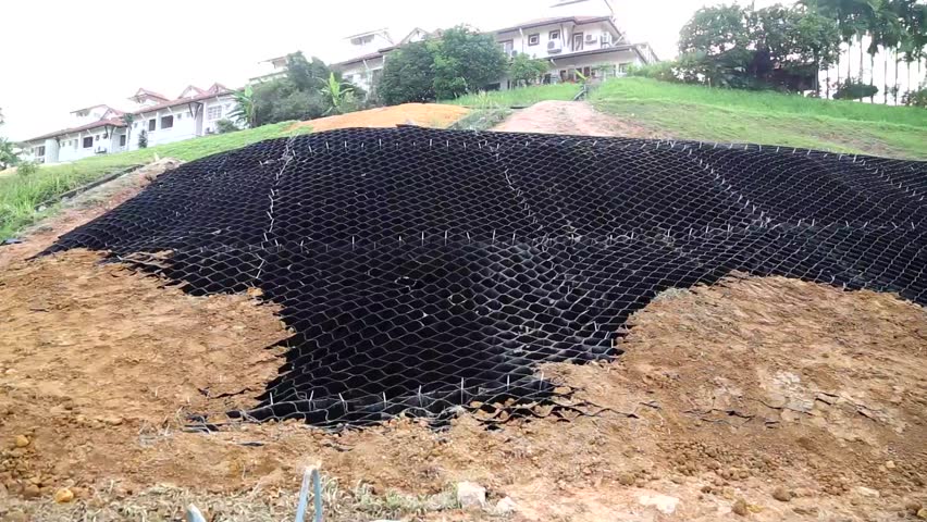 Zoom Out Shot From Erosion Control Grids To Steep Slope Where ...