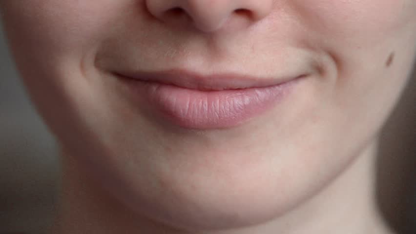 Stock video of closeup of woman mouth smiling and | 12860681 | Shutterstock