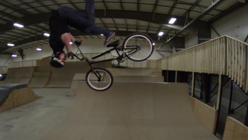 Extreme Sport Indoor Skateboard Park - BMX Bike Rider Doing Acrobatic ...