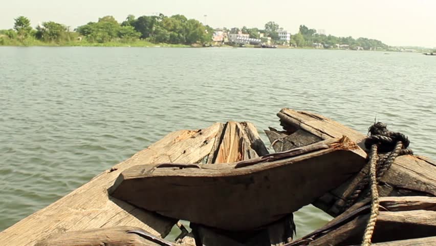 A Logging Boom Boat Is Moored Alongside A Fast Moving River/Boom Boat/A ...