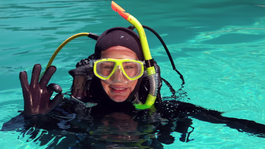 Stock Video Clip of Woman in scuba diving doing ok sign | Shutterstock