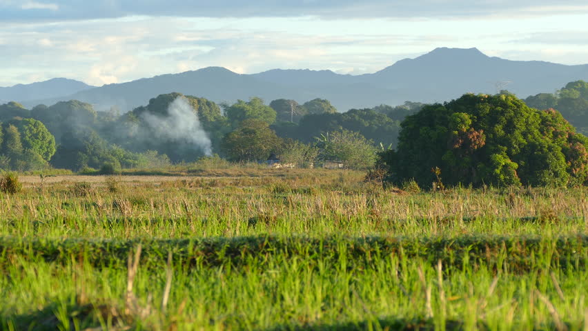 Stock video of morning farmland landscape with mountains in | 14070161 ...