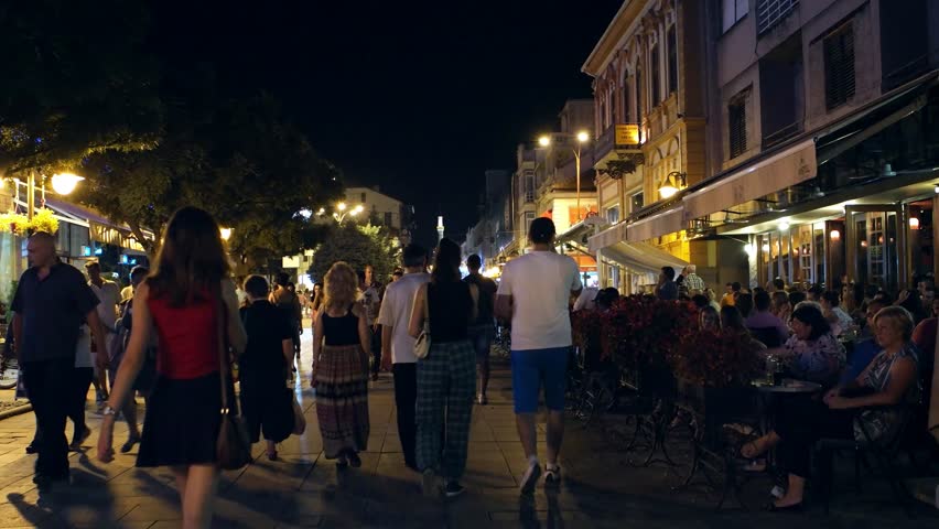Stock Video Clip of BITOLA, MACEDONIA - JULY, 2015: People walking ...