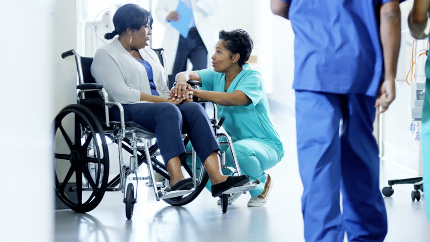 African American Empathy Female Nurse And Disabled Patient Consult In ...