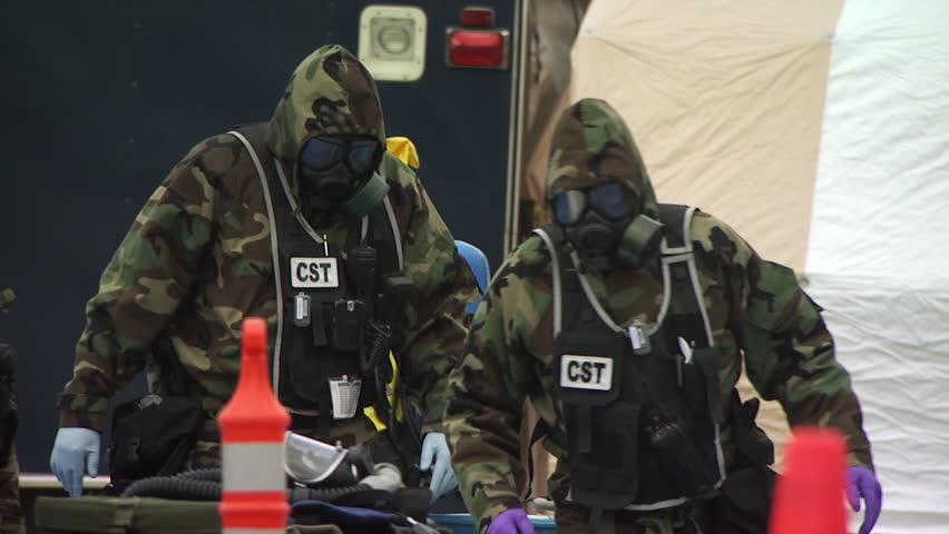 HAZMAT Team Members Wearing Protective Suits To Protect Them From ...