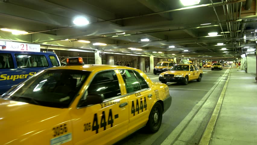 Stock video of passanger drop off zone with taxi | 16507261 | Shutterstock