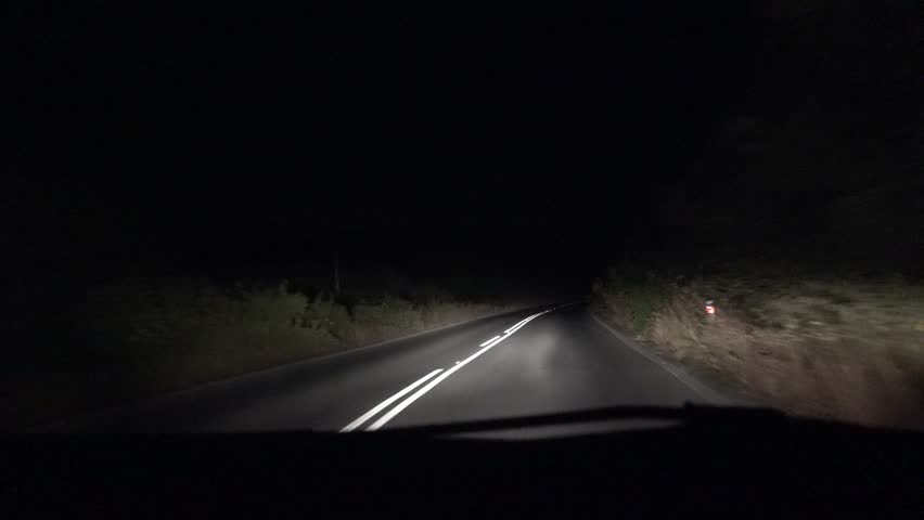 Driving Down Rural Highway In Pitch Black Night Timelapse Loop. Running ...