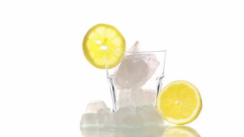 Pouring Apple Juice Into A Glass Of Ice Cubes With A Slice Of Lemon Stock Footage Video 2092085 ...