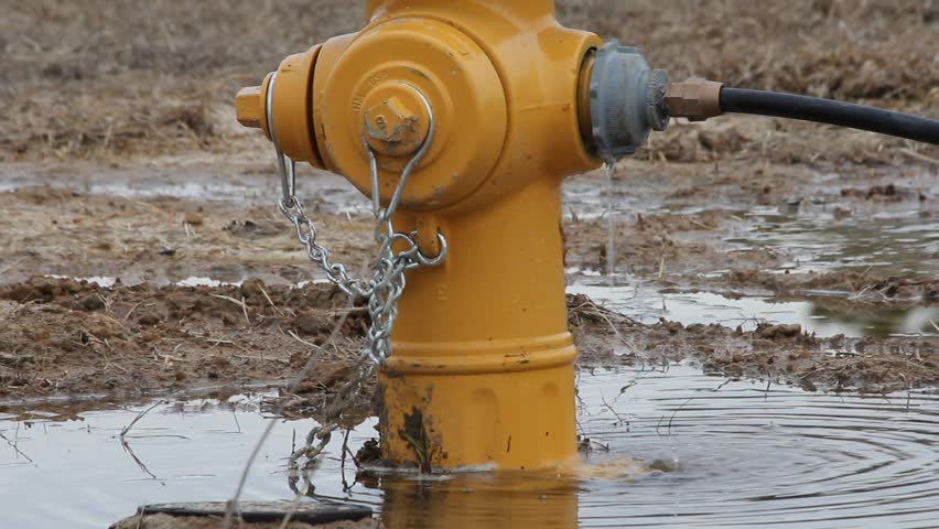 Stock video of yellow fire hydrant lower section leaking | 1982011 ...