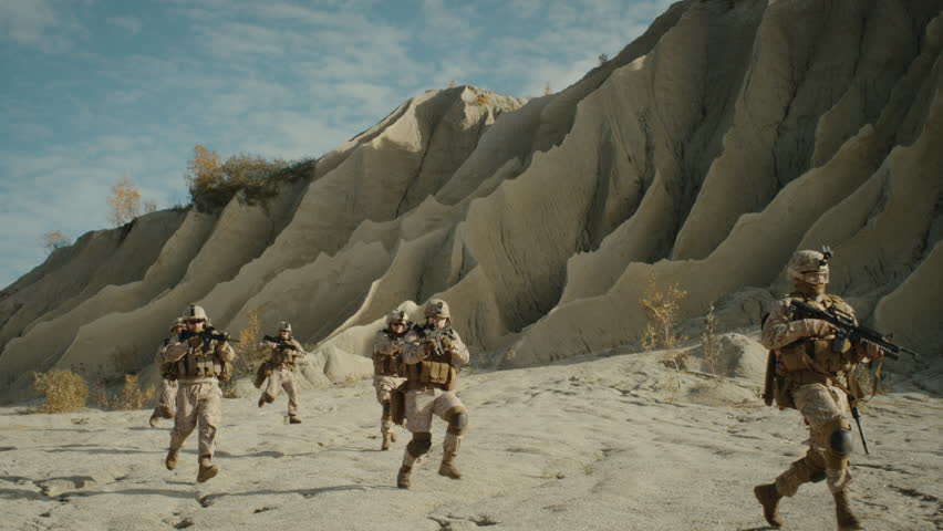 Squad Of Three Fully Equipped And Armed Soldiers Standing On Hill In ...