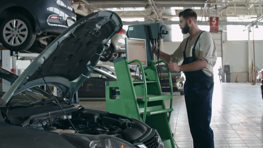 Car Stand In Car-care Center Garage With Open Hood, Time Lapse Stock ...