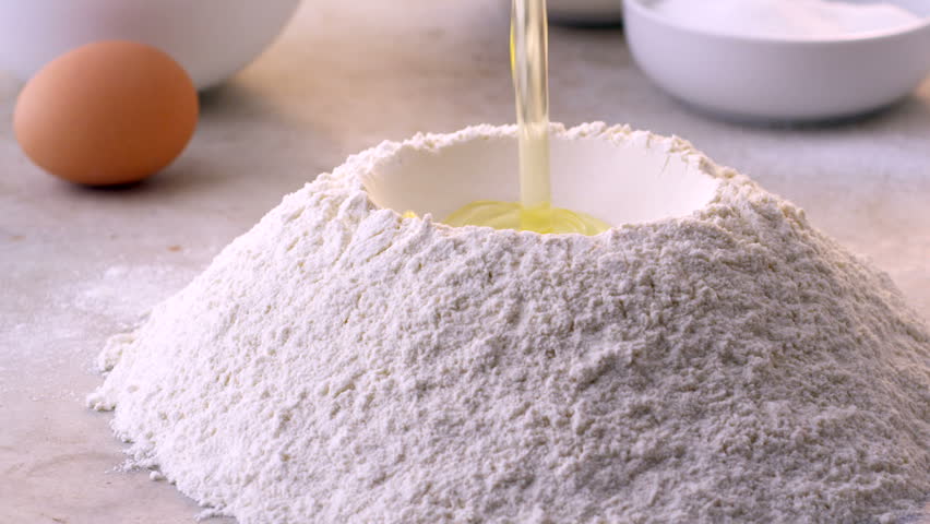 Egg Dropping Into Flour Stock Footage Video (100% Royalty-free) 2132381 ...