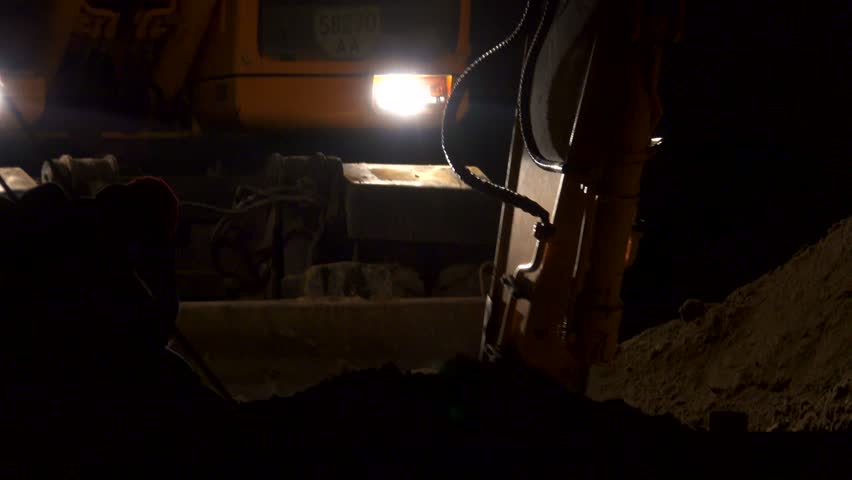Bucket Excavator Digging A Hole At Night, Close-up Stock Footage Video ...
