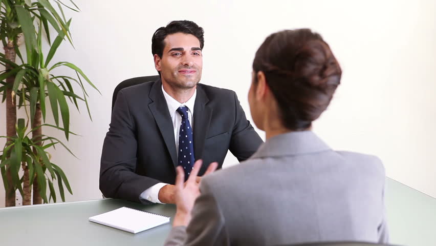 Stock video of business people sitting at a desk | 2214361 | Shutterstock