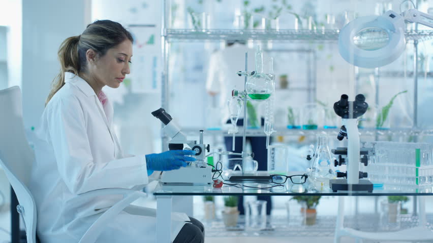 4K Research Scientists Studying Plant Life In Laboratory Dec 2016-UK ...