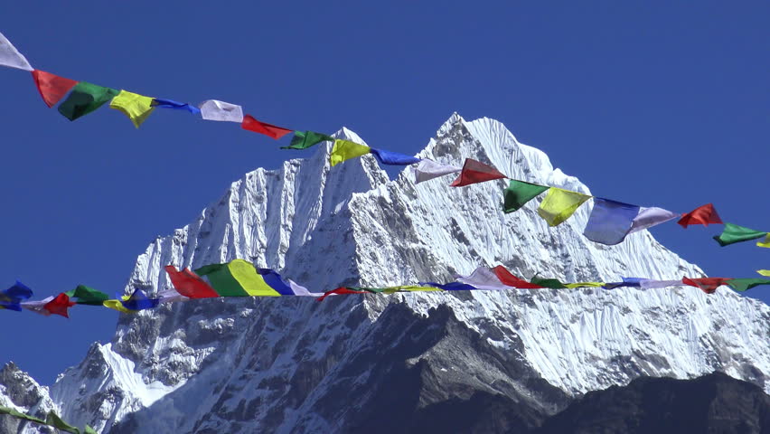 Buddhist Colorful Prayer Flags Blow By The Wind In The Mountains In ...
