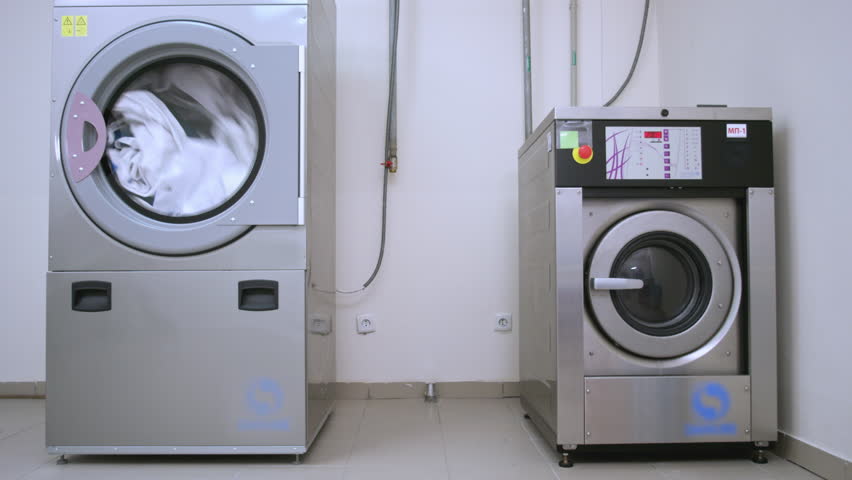 Industrial Washing Machine Washing Clothes. Laundry Machine Working ...