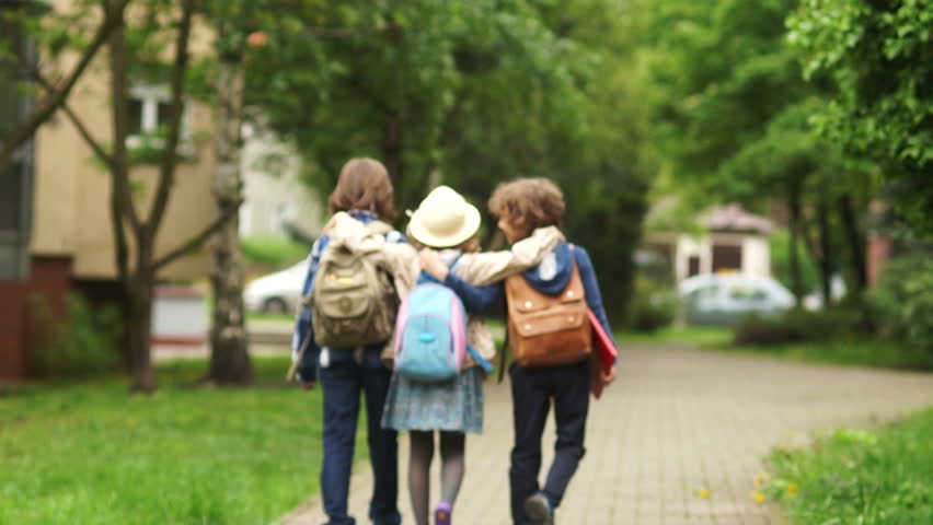 Kids Approaching Camera Running Away From School And Throwing Their ...