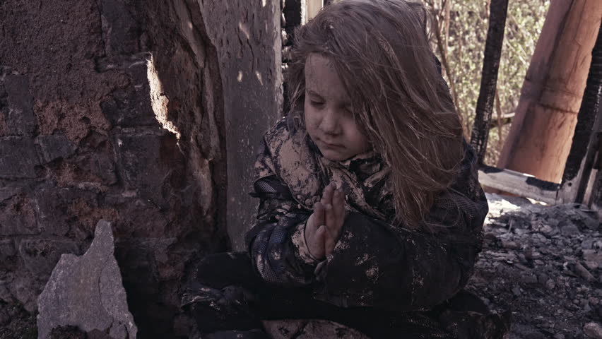 Stock Video Clip of Hungry homeless children near the ruins. The ...
