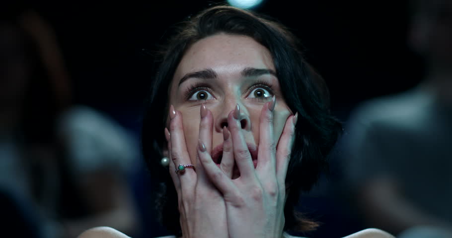 A Young Woman Beings To Get Upset While Watching A Sad Movie At The ...