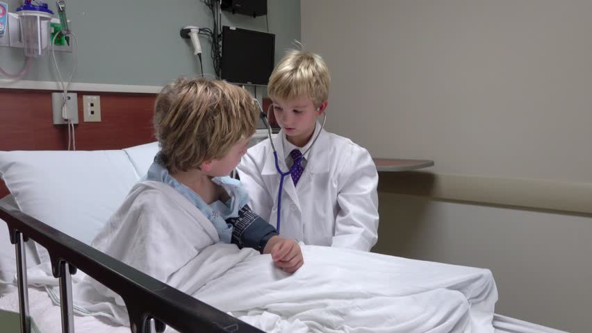 Stock Video Clip of Little boys playing doctor and patient in ...