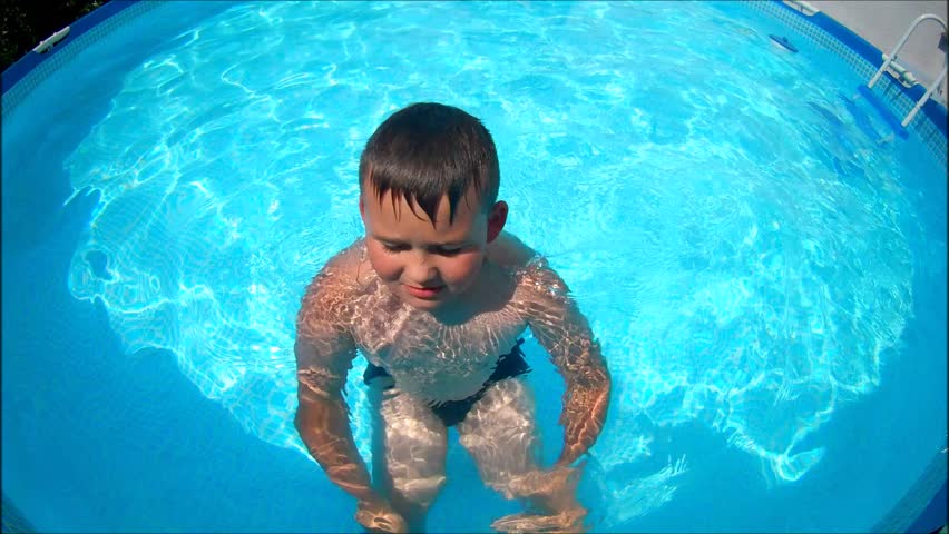 Little Boy Swimming In Pool On Orange Inflatable Rubber Ring. Stock ...