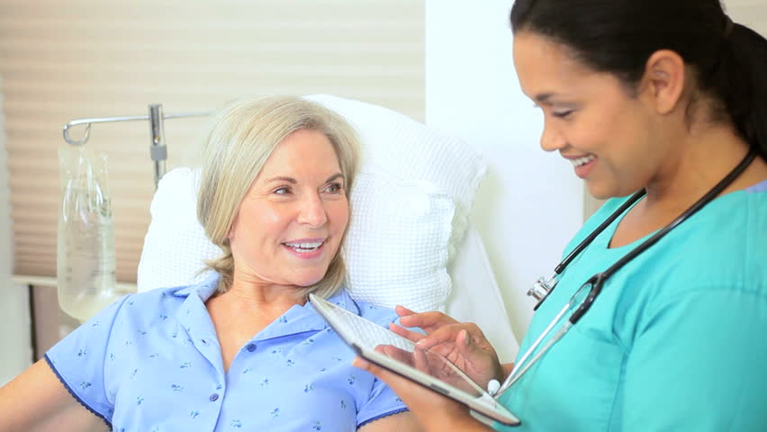 Stock video of close up hispanic nurse recording senior | 2870041 ...