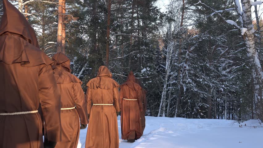 Lonely Monk In Hood Robe Walking Along Winter Snow Trail In Forest ...