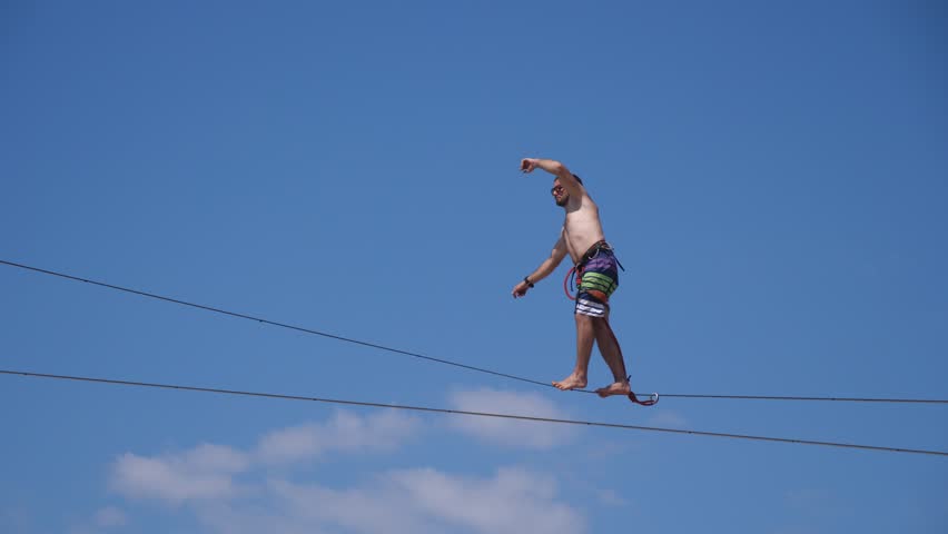 Tightrope Walking On A High Rope Stretched Stock Footage Video 16372624 ...
