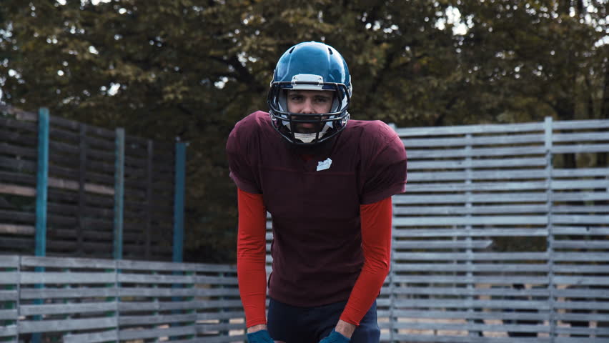 Slow Motion Of American Football Player Practising Throwing Ball During ...