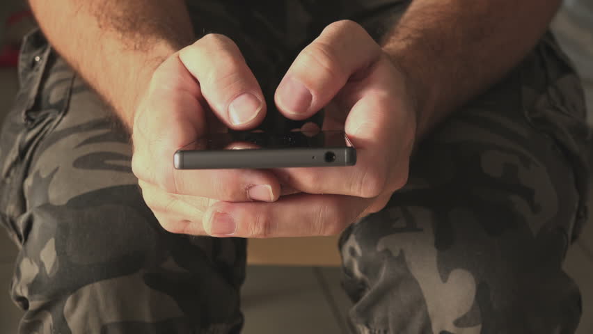 Military Soldier Using Smartphone for Stock Footage Video (100% Royalty ...