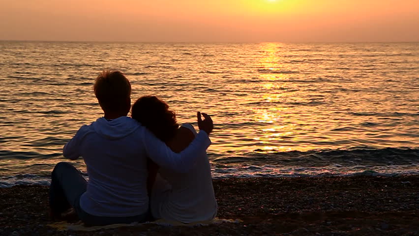 Young Couple Sitting On The Beach, Hugging Stock Footage Video 3682931 ...