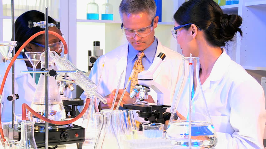 Student Doctors Examining Medical Research Specimens In Modern ...