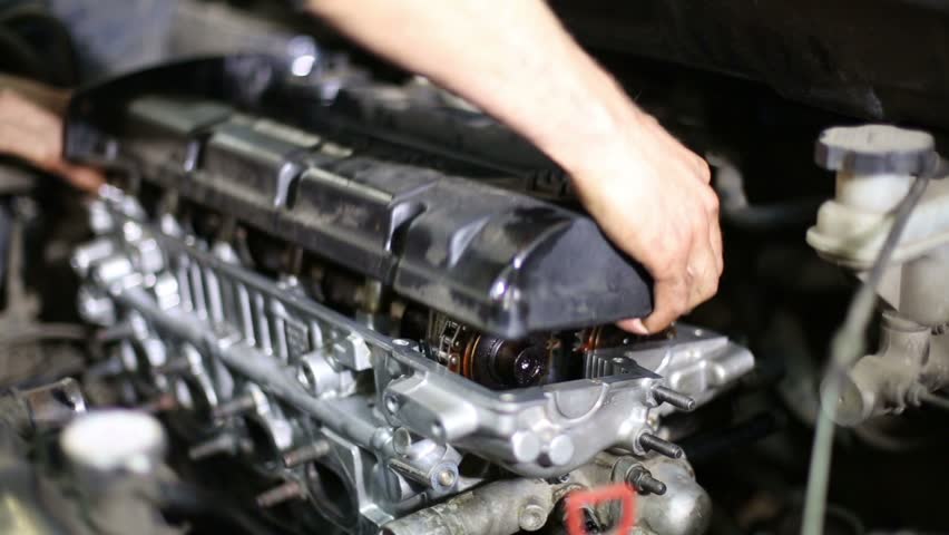 Hand Of Auto-mechanic Repairing Gasoline Car Engine By Screwdriver ...