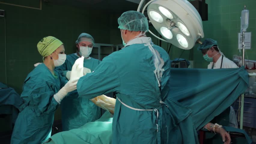 Surgeons Team Performing Operation In Hospital Operating Room.Surgeon ...