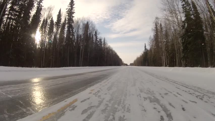 Snow Driving Forrest Alaska. Car On Snow Covered Highway Lined With ...