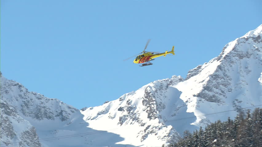 Stock video of helicopter flying over mountain | 5920001 | Shutterstock