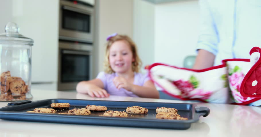Stock video of mother taking hot cookies from oven | 5932841 | Shutterstock