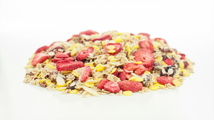 Mixed Muesli Rotating On The White Table With White Seamless Background ...