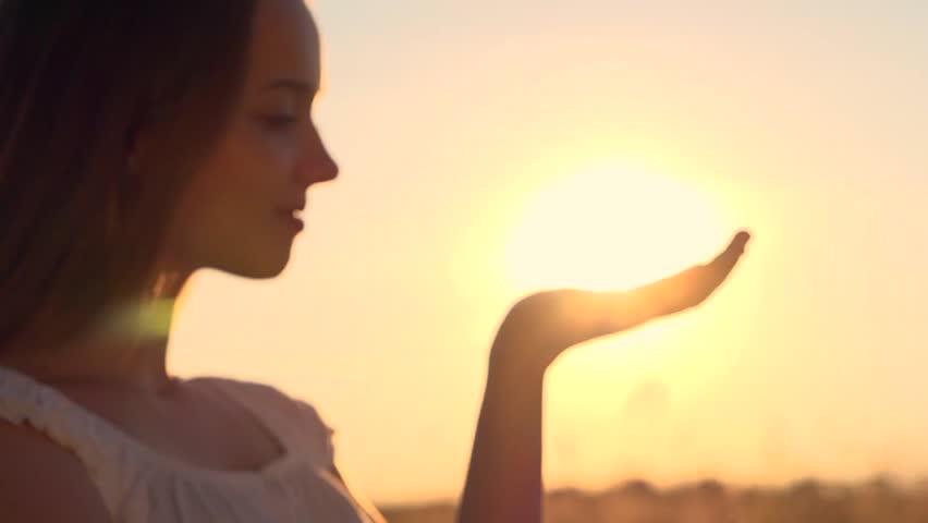 Sun In Hands. Woman Hand Catching A Sun Against Beautiful Sunset On ...