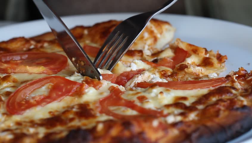 Slow Motion Close-up Of Drooping Slice Of Pepperoni Pizza Cooked In ...