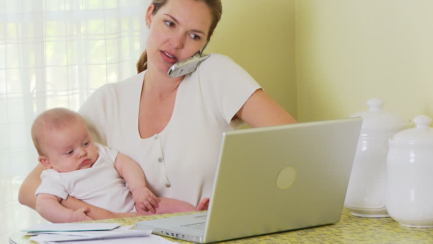 Multitasking Mother, Busy Mom And Businesswoman Working With Laptop ...